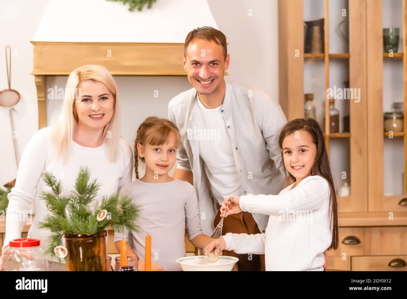 The young happy family is getting ready for the Christmas and Advent ...