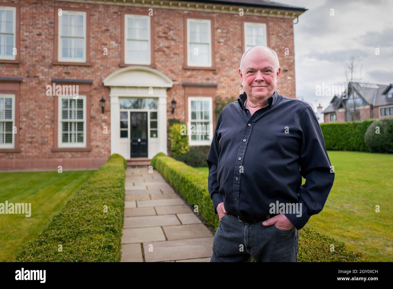 Sir Bernard Gray poses for a portrait at home in Bowden, UK Stock Photo ...