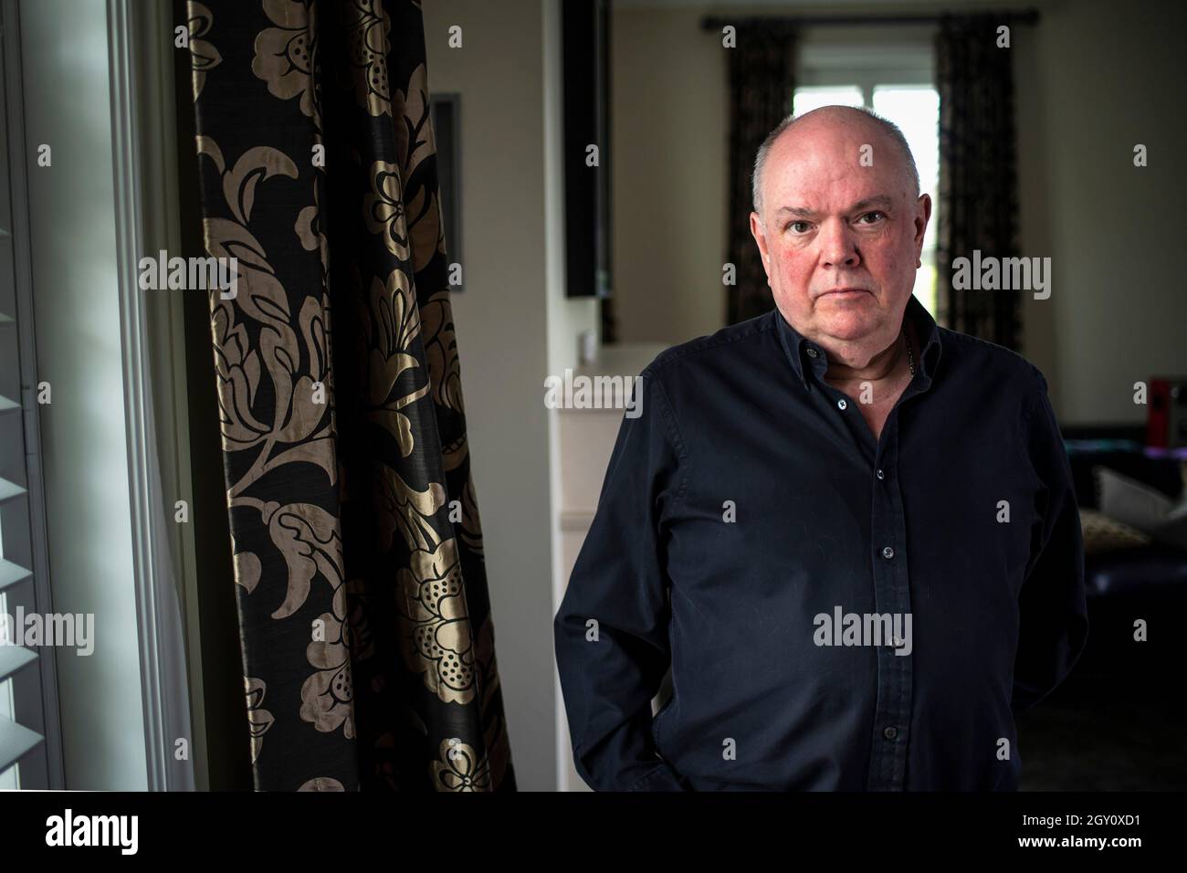 Sir Bernard Gray poses for a portrait at home in Bowden, UK Stock Photo - Alamy