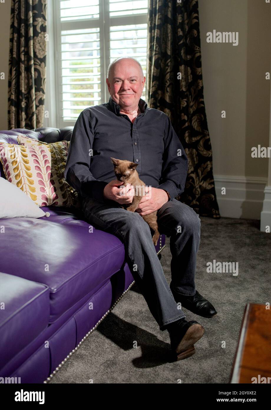 Sir Bernard Gray poses for a portrait at home in Bowden, UK Stock Photo ...