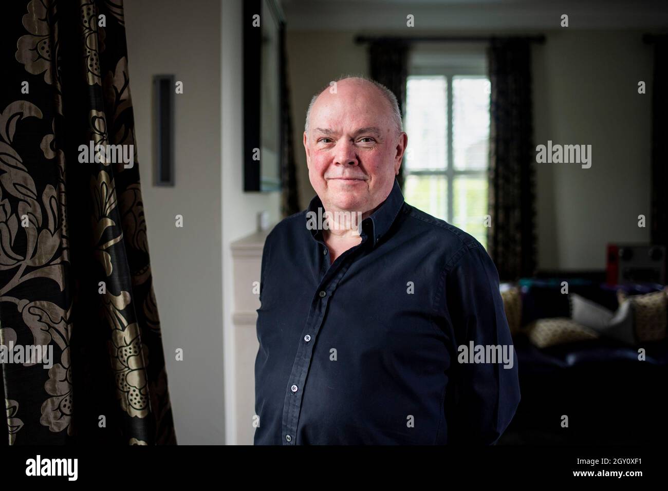Sir Bernard Gray poses for a portrait at home in Bowden, UK Stock Photo ...