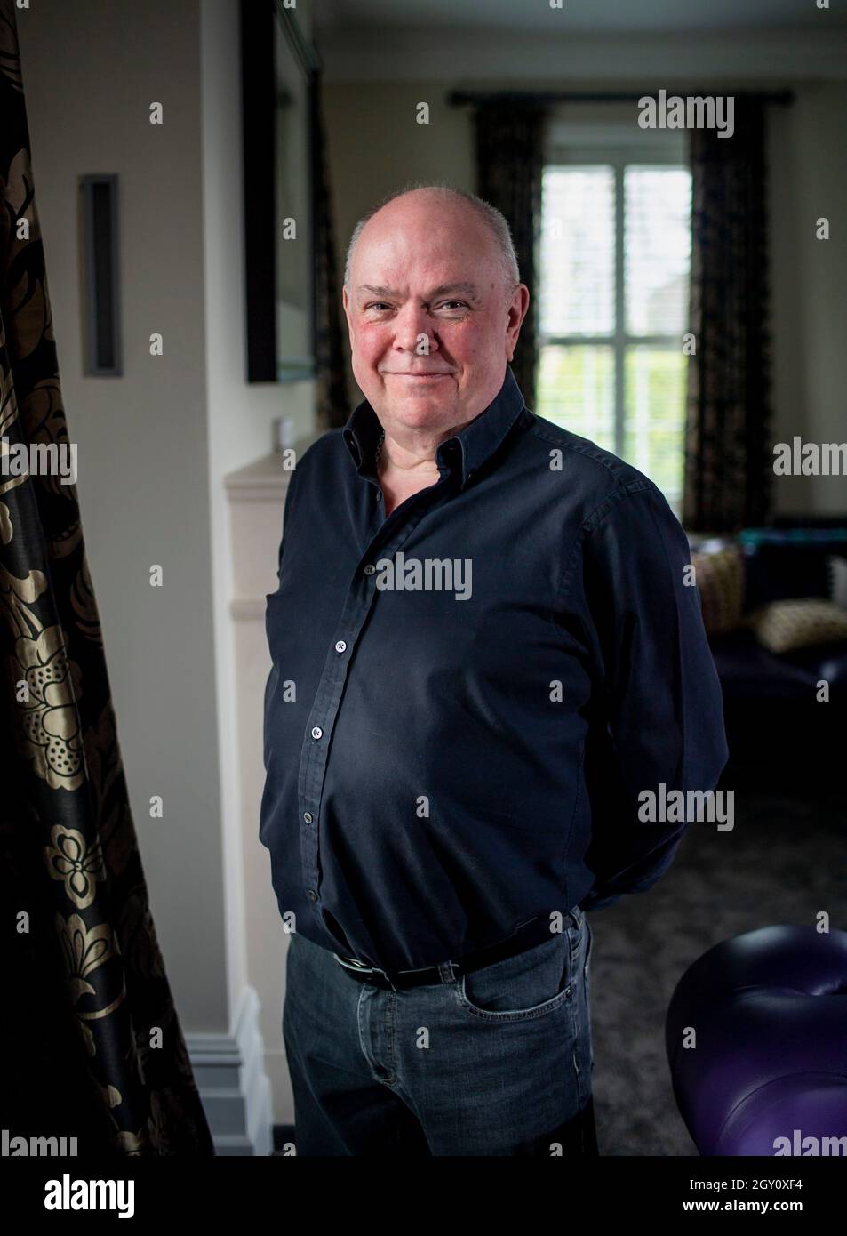Sir Bernard Gray poses for a portrait at home in Bowden, UK Stock Photo ...