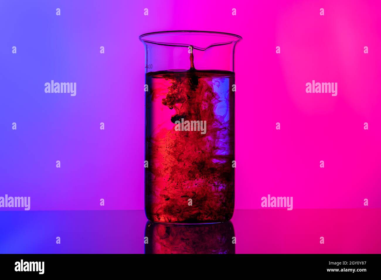 Laboratory glass tubes with chemicals on bright pink background Stock ...