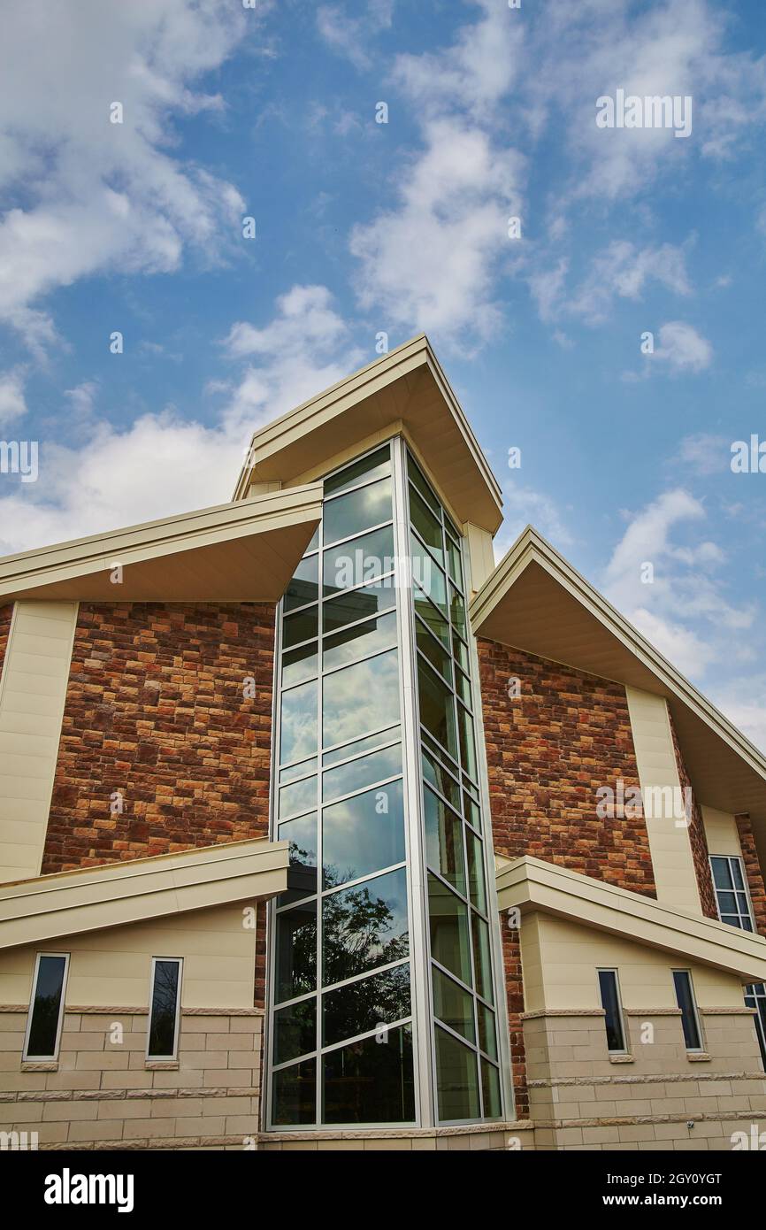 Large windowed chapel with a brick facade during the day Stock Photo ...