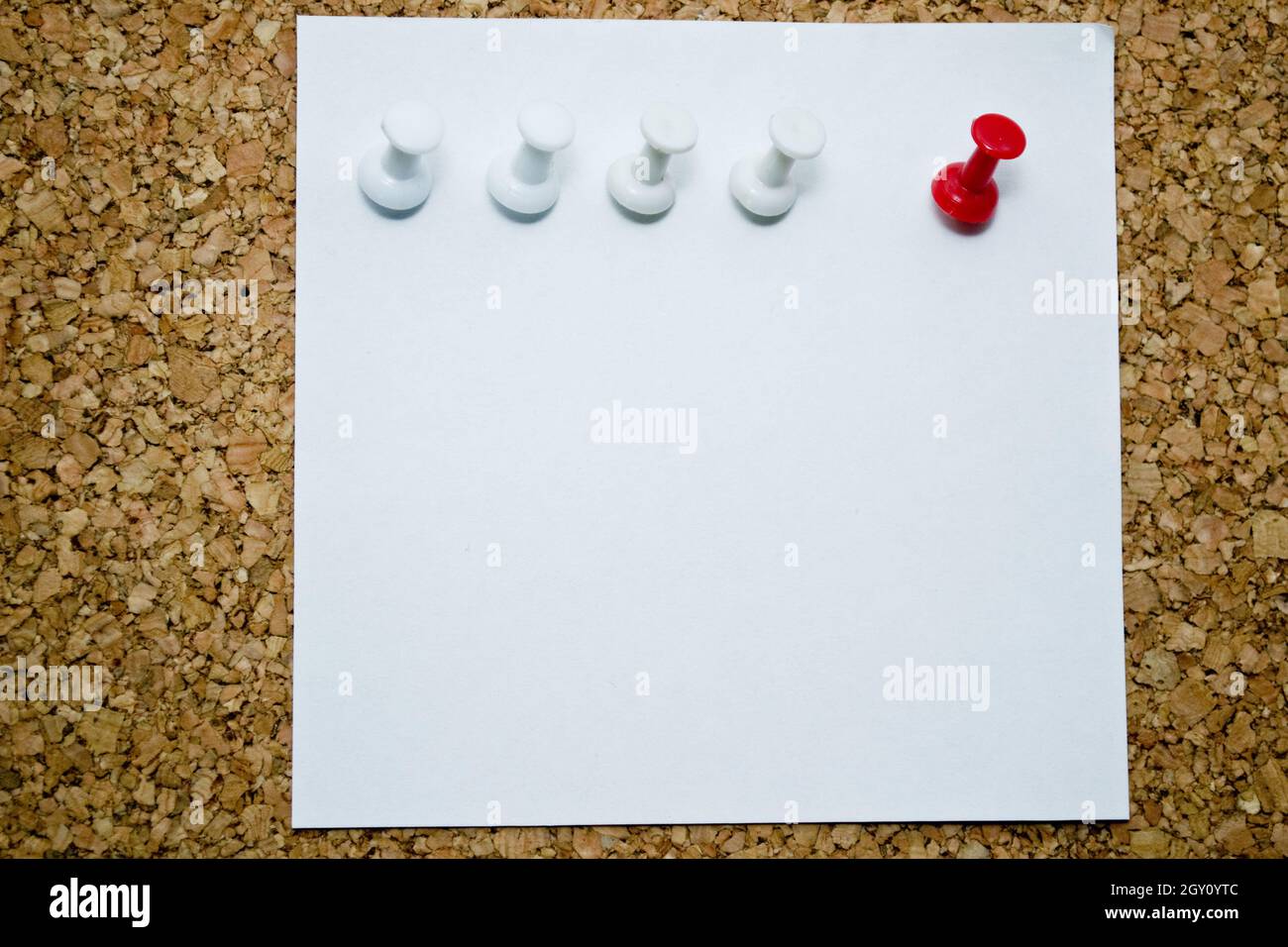 Close-up of cork board with white sticky note Stock Photo - Alamy