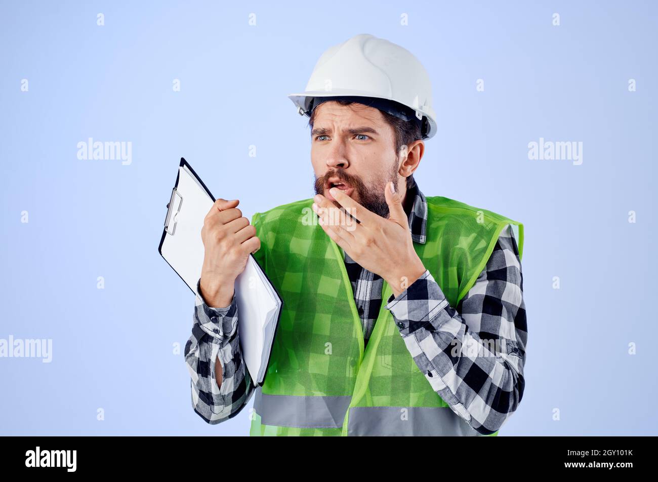 engineer with documents and drawings blueprints isolated background ...