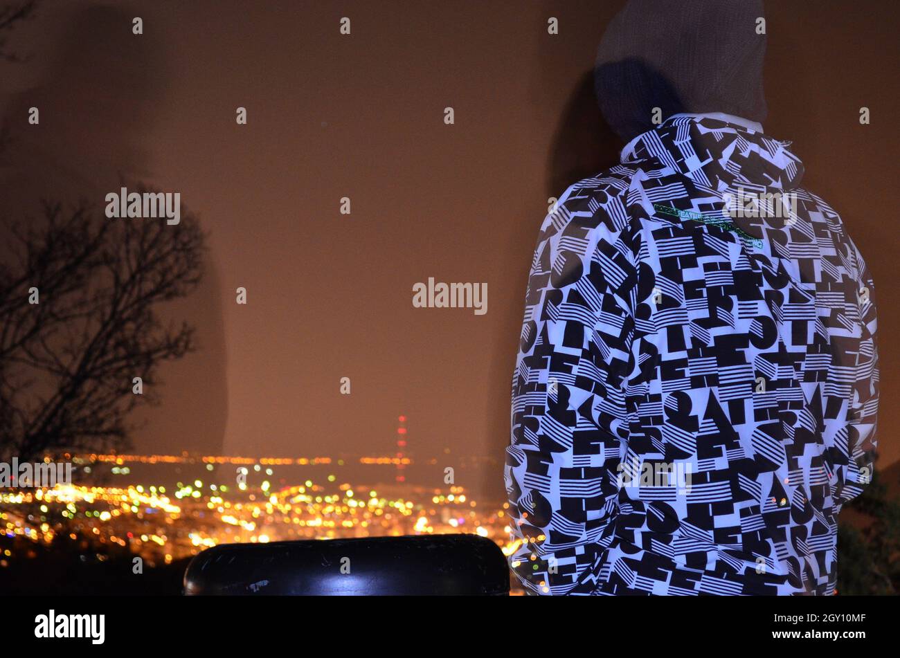 Double exposure with person and city lights in the distance Stock Photo ...