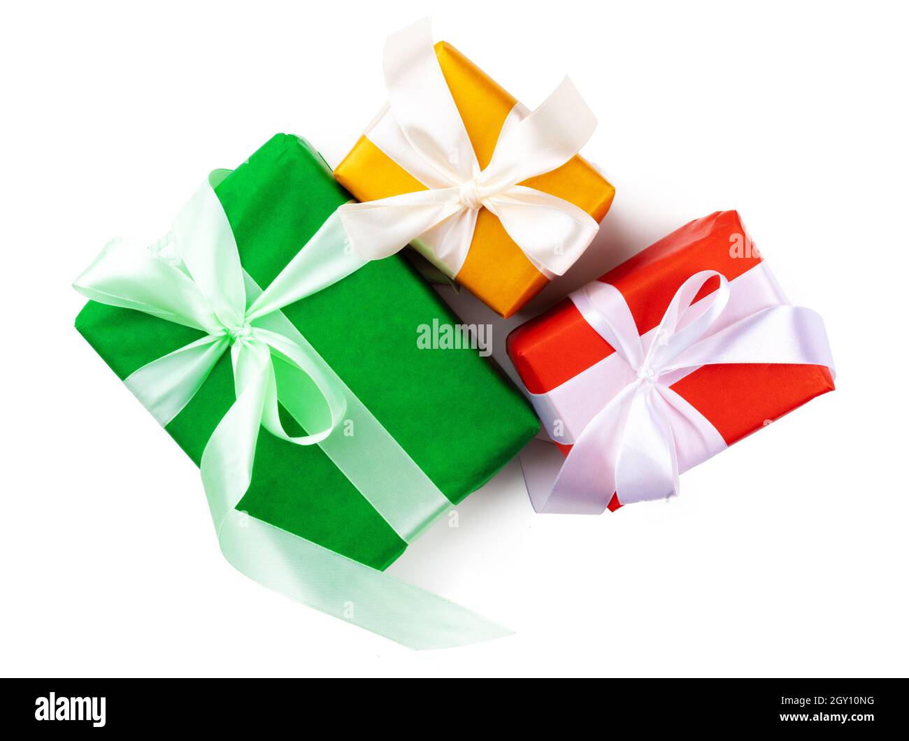 Three beautiful wrapped gifts isolated on white background Stock Photo ...