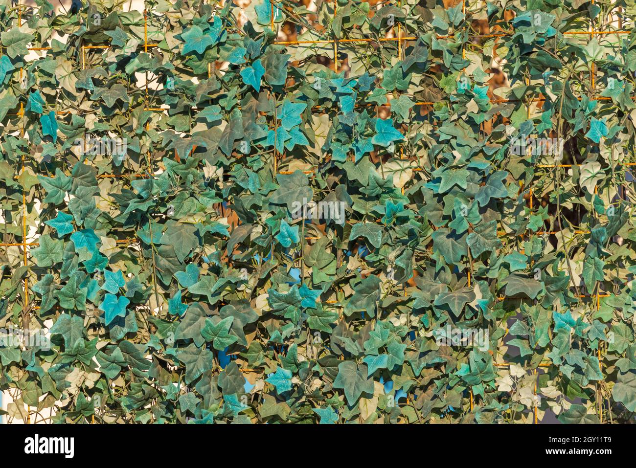 Artificial Plastic Leaves Foliage Wall Structure background Stock Photo ...