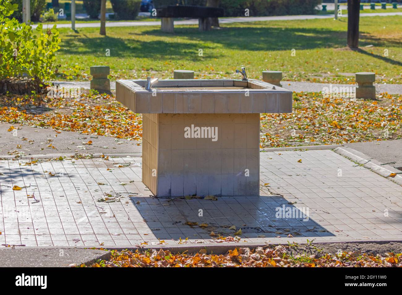 Drinking Tap Water Fountain in Park at Autumn Stock Photo - Alamy