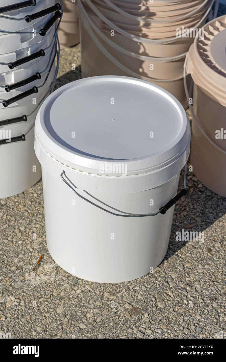 Big White Paint Plastic Bucket With Lid and Handle Stock Photo - Alamy