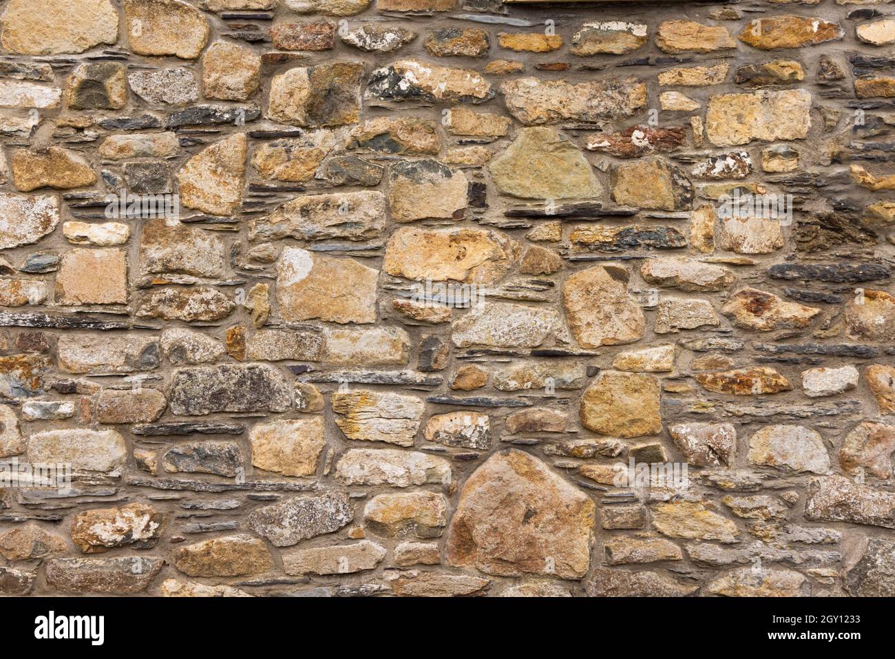 Close up of a stone wall made of Welsh stone. Background texture Stock ...