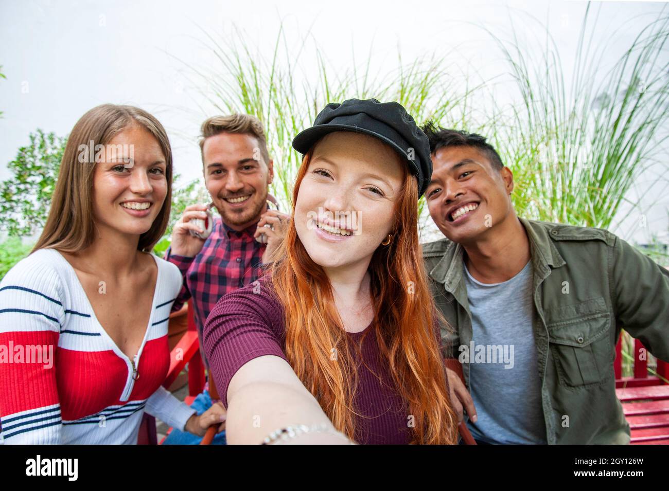 Multicultural guys and girls taking selfie outdoors - Happy friendship ...