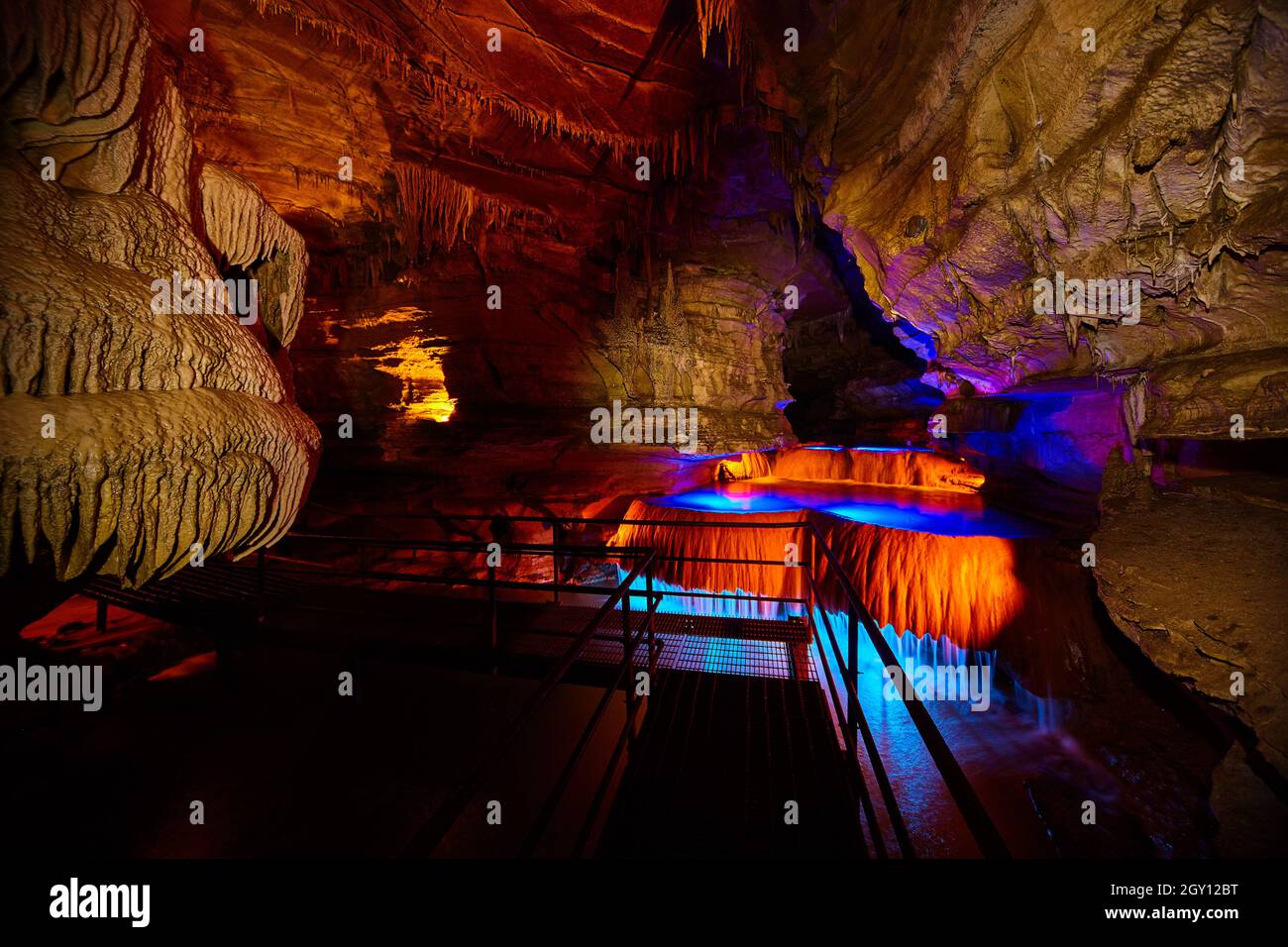 Tour path through Indiana underground cave with waterfall lite by blue ...