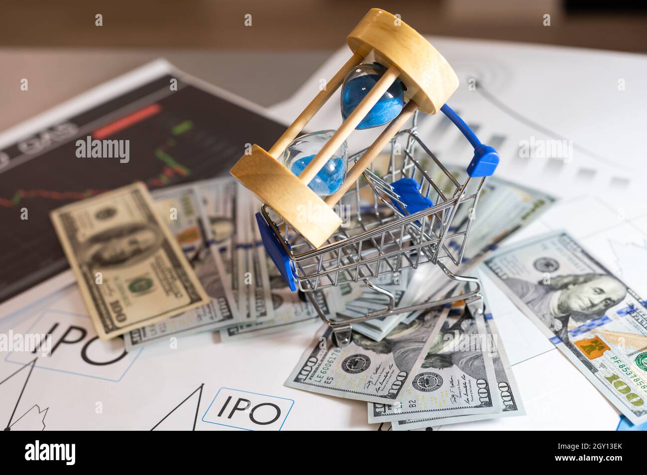 Business Charts with Dollar Money, hourglass Stock Photo - Alamy