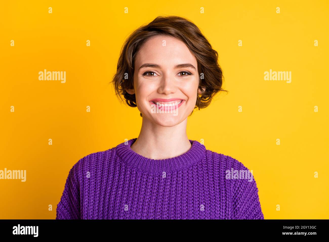 Close-up portrait of lovely cheerful glad girl wearing violet sweater ...