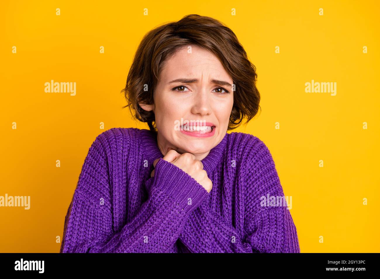 Photo portrait of scared distressed woman holding hands together ...