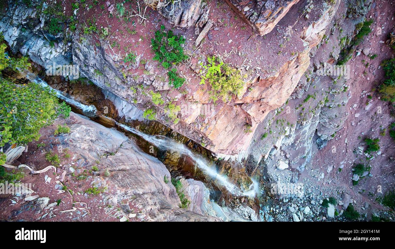Tall waterfall in gorge falling of cliff edge from very top view Stock ...
