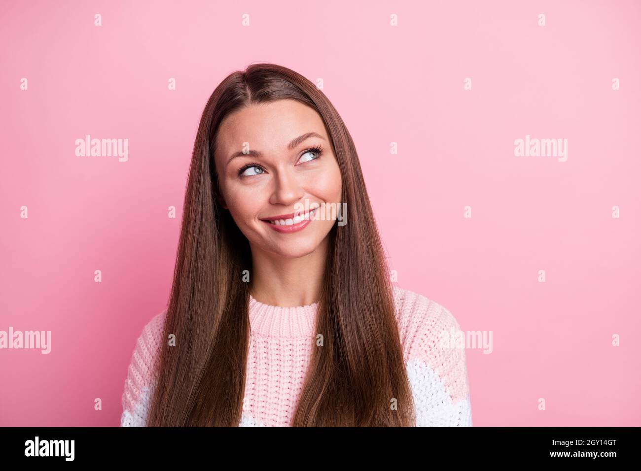 Photo of dreamy happy charming young woman look empty space smile ...