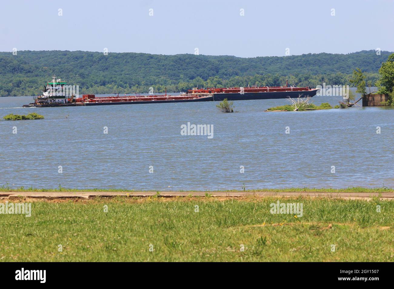 A large riverboat barge floats down on the river Stock Photo - Alamy