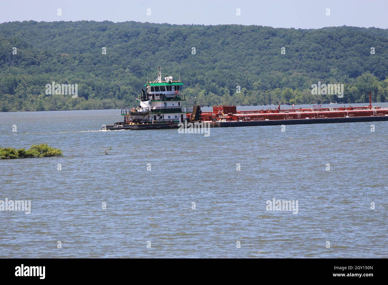 A large riverboat barge floats down on the river Stock Photo - Alamy