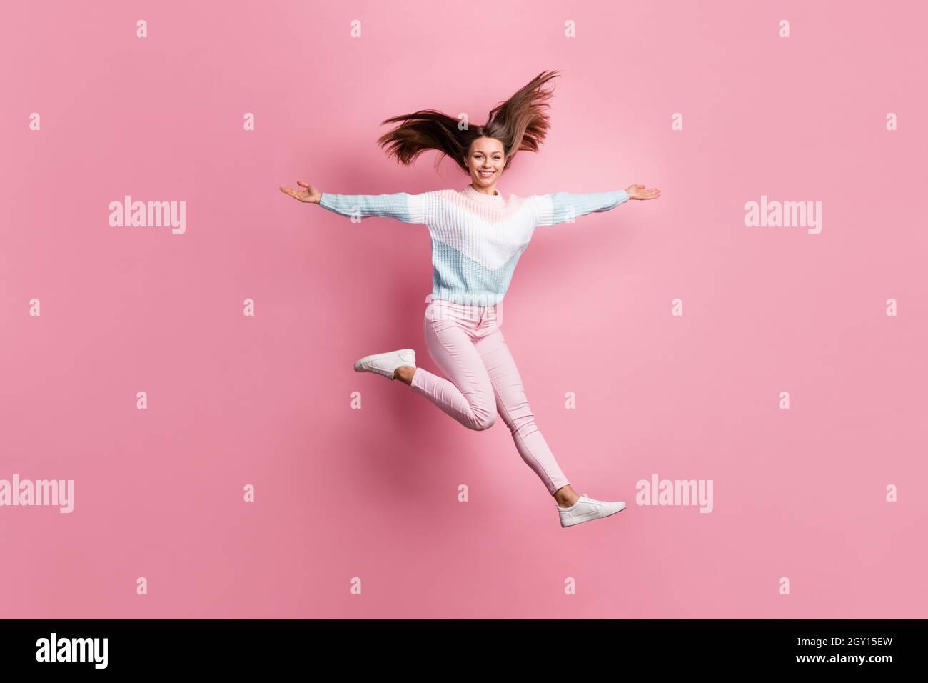 Full length body size photo of playful childish girl jumping up in ...