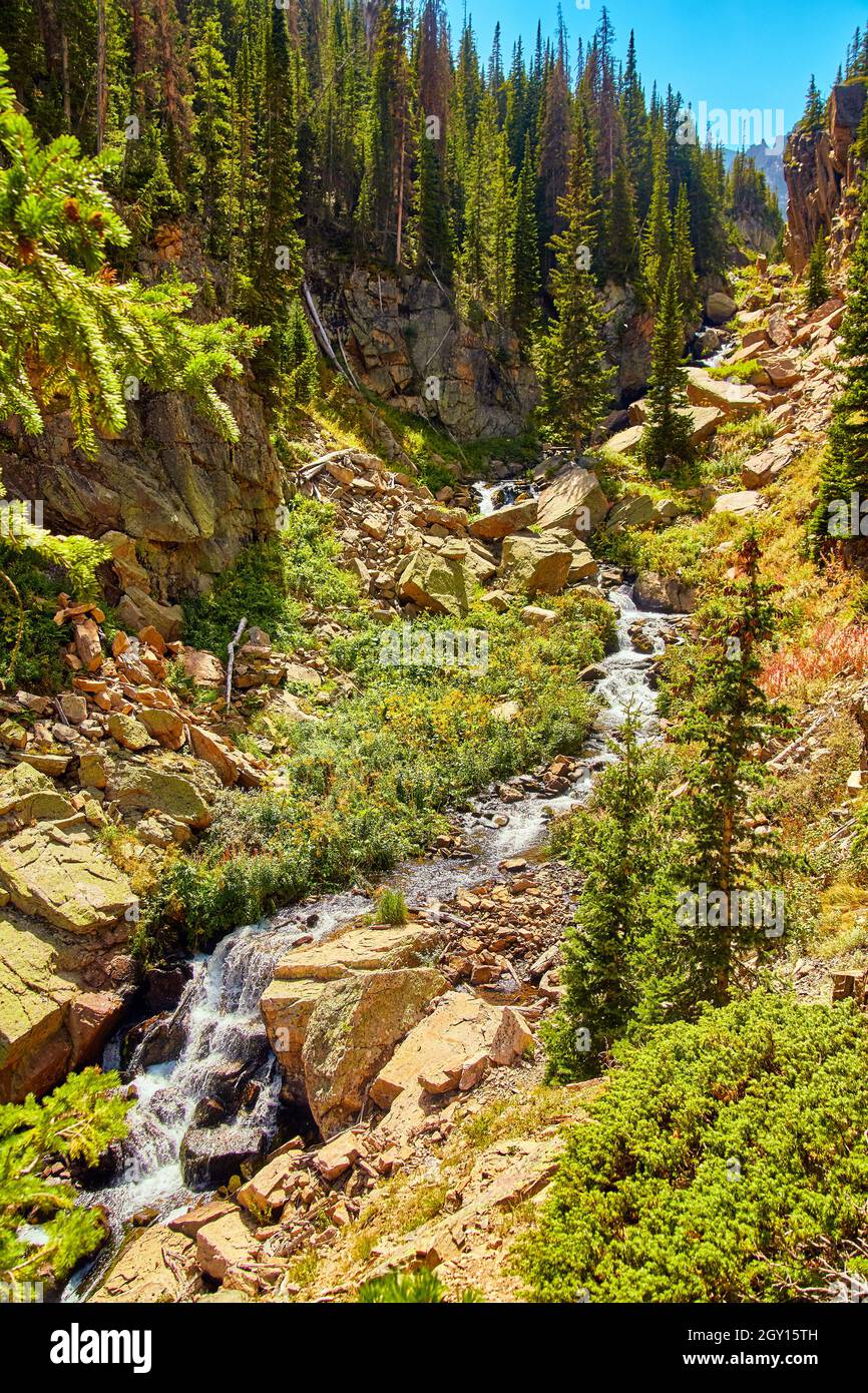 River and waterfalls through canyon of mountain with lush green and ...