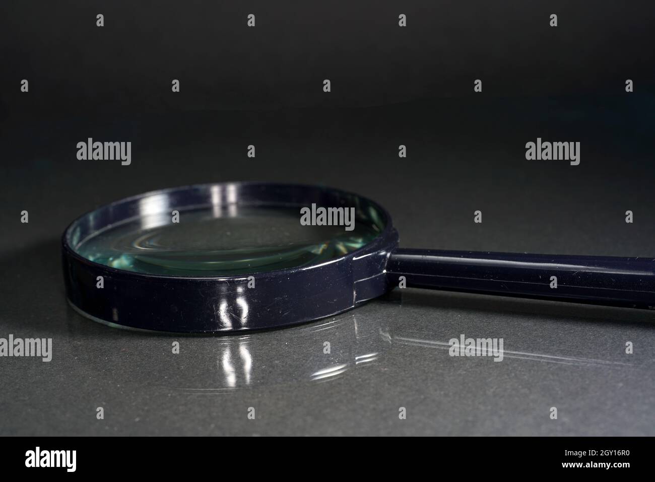 Close up shot of a glass lens of a zooming object in a circle shape and ...