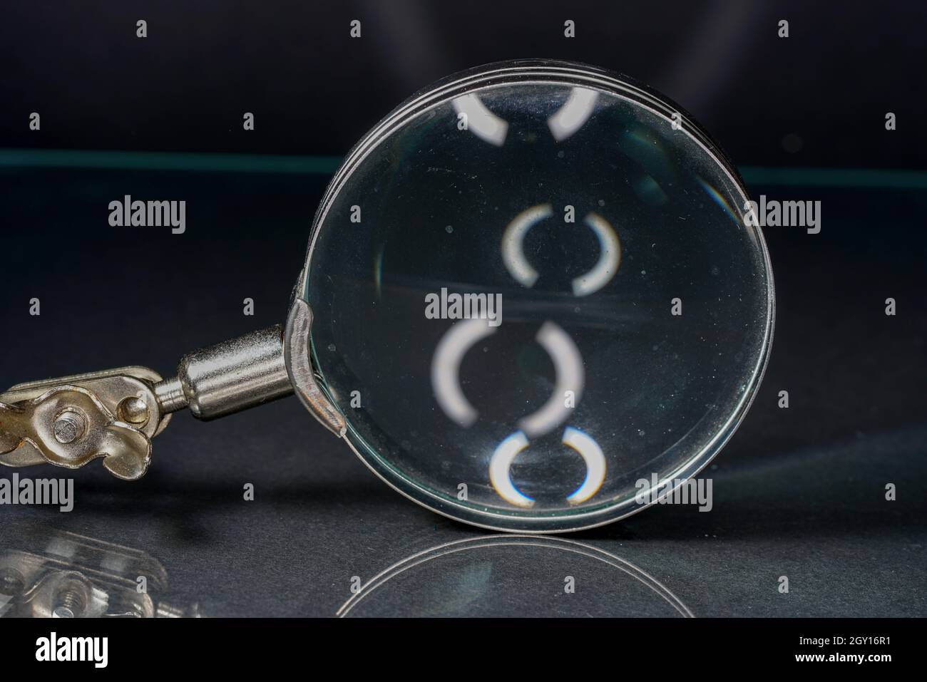 Close up shot of a glass lens of a zooming object in a circle shape and ...