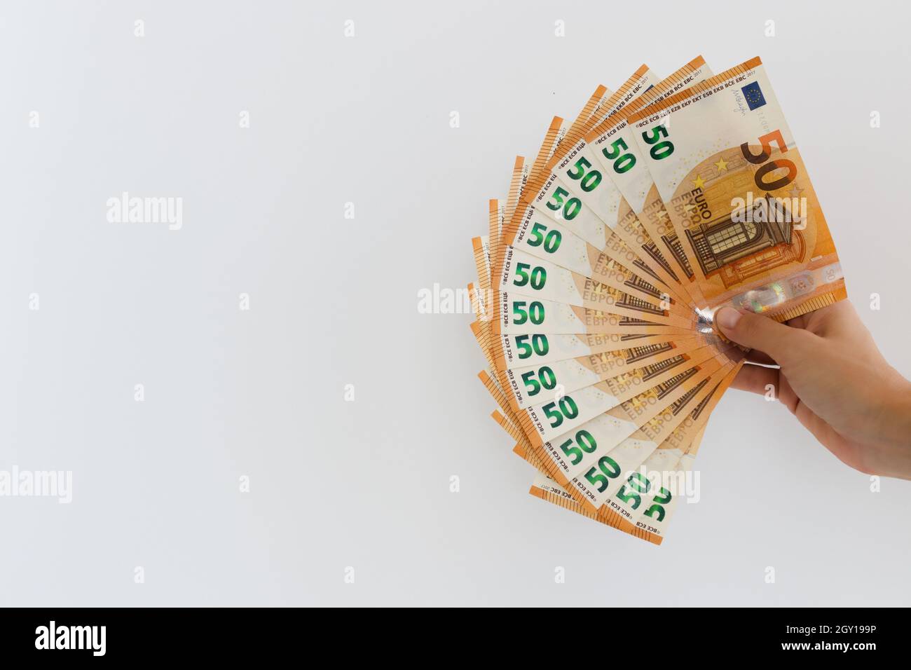 Hand holding euro money or giving money. On a white background with ...
