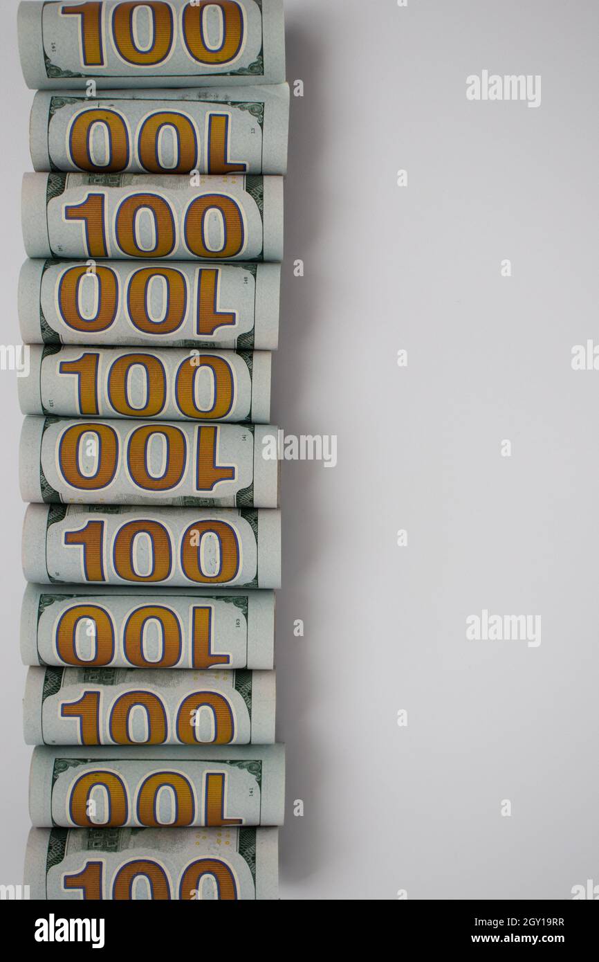 Rolled 100 dollars on white with copy space. American money Stock Photo ...