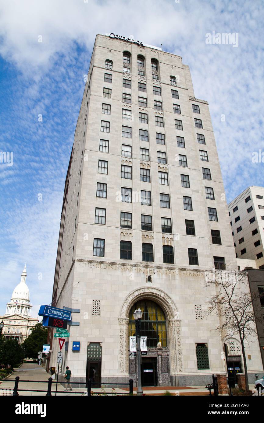 Large white marble building with a white cloudy sky in Lansing Stock ...