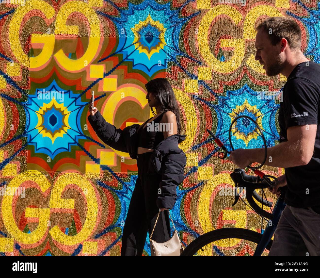 London, UK. 06th Oct, 2021. A young woman takes photos of the colourful ...
