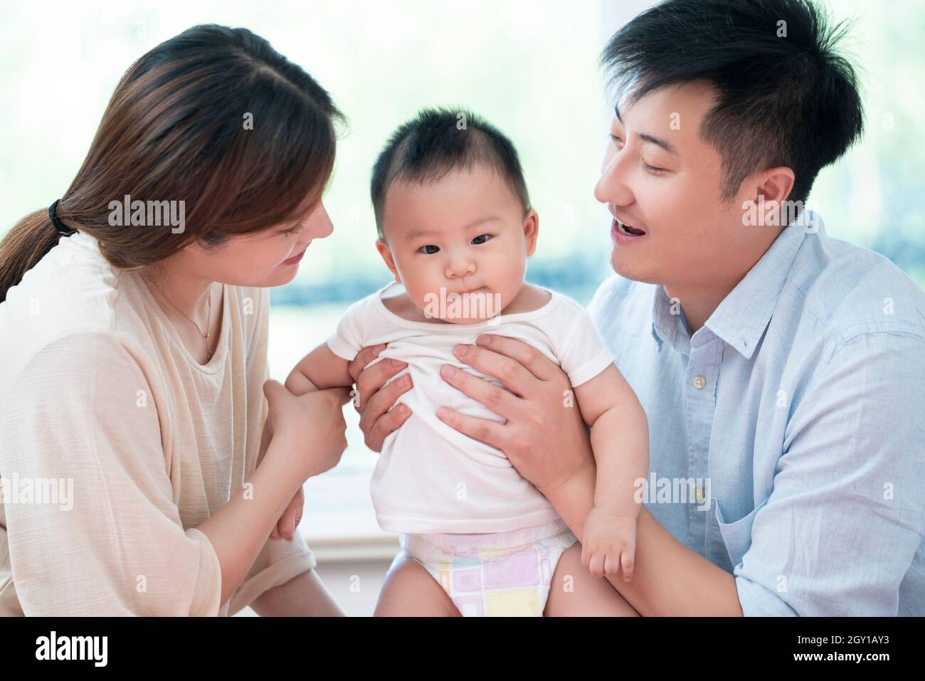 East asian family with one child family hi-res stock photography and ...