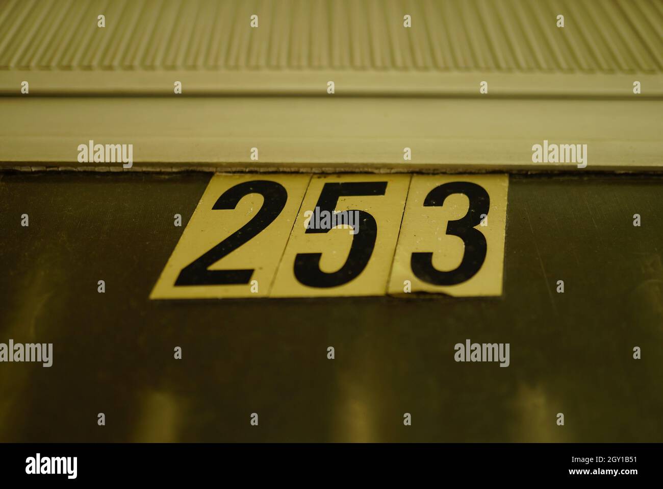 Low angle shot of a street number on a building Stock Photo - Alamy