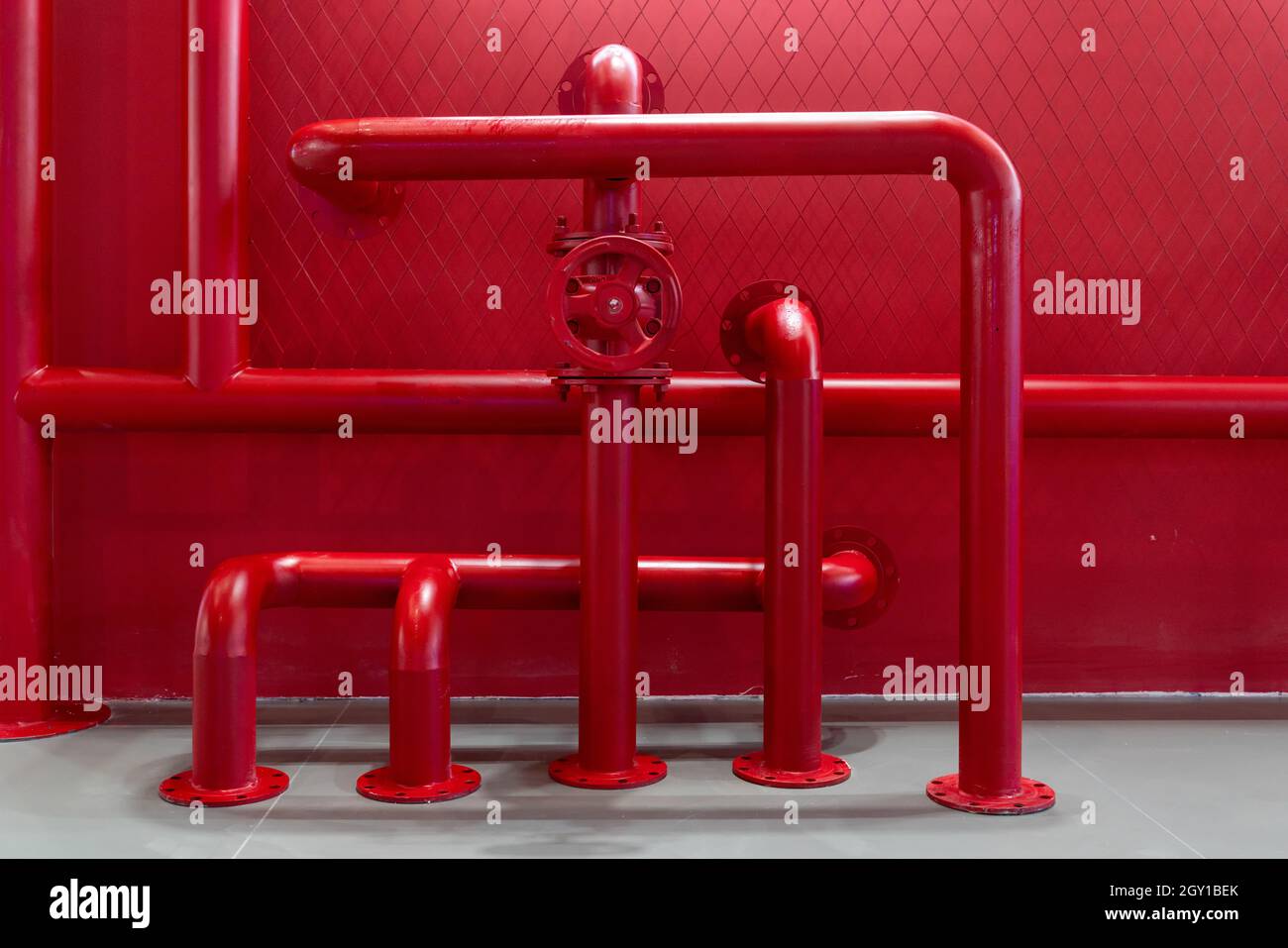 Scenic shot of red pipelines and valves in the factory Stock Photo - Alamy
