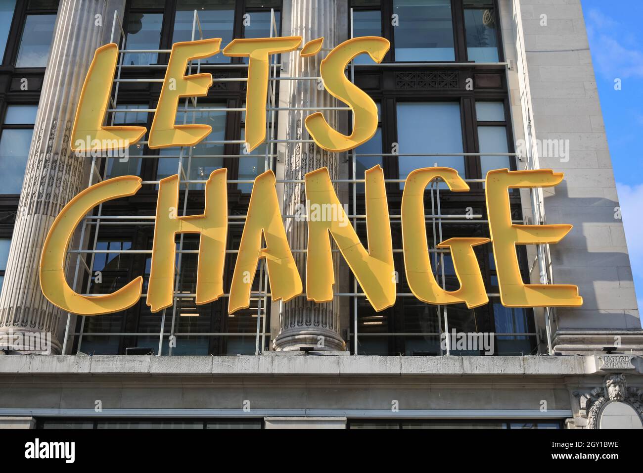 ‘Let’s Change The Way We Shop’ sign outside Selfridges flagship store ...
