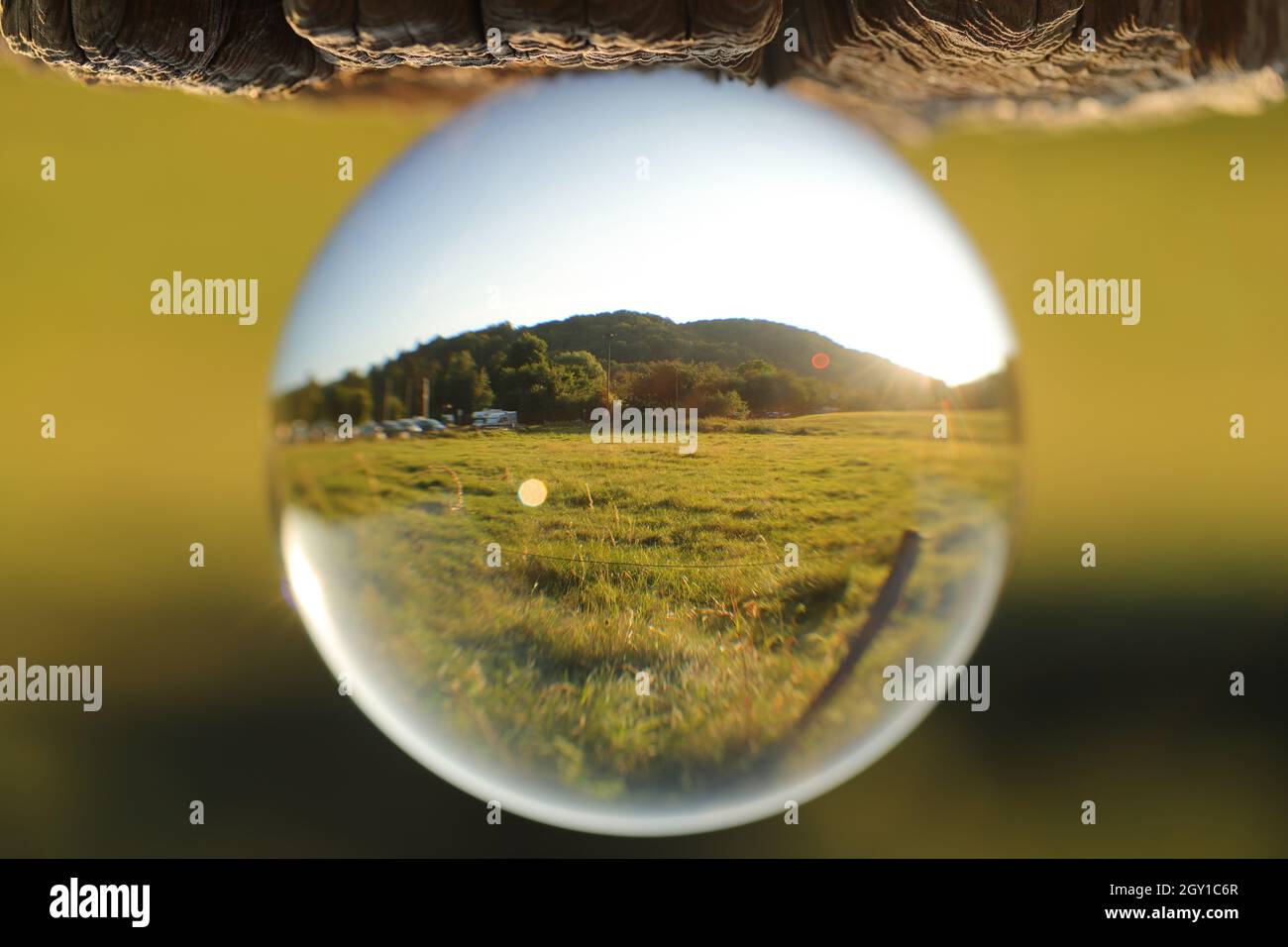 a beautiful landscape photographed through a lens ball Stock Photo - Alamy