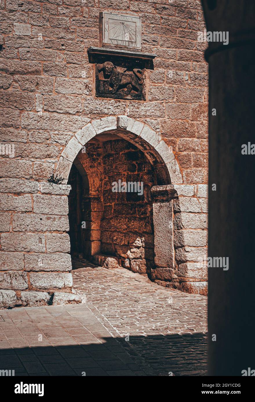 Vertical shot of an arch in an aged building in Rovinj, Croatia Stock ...