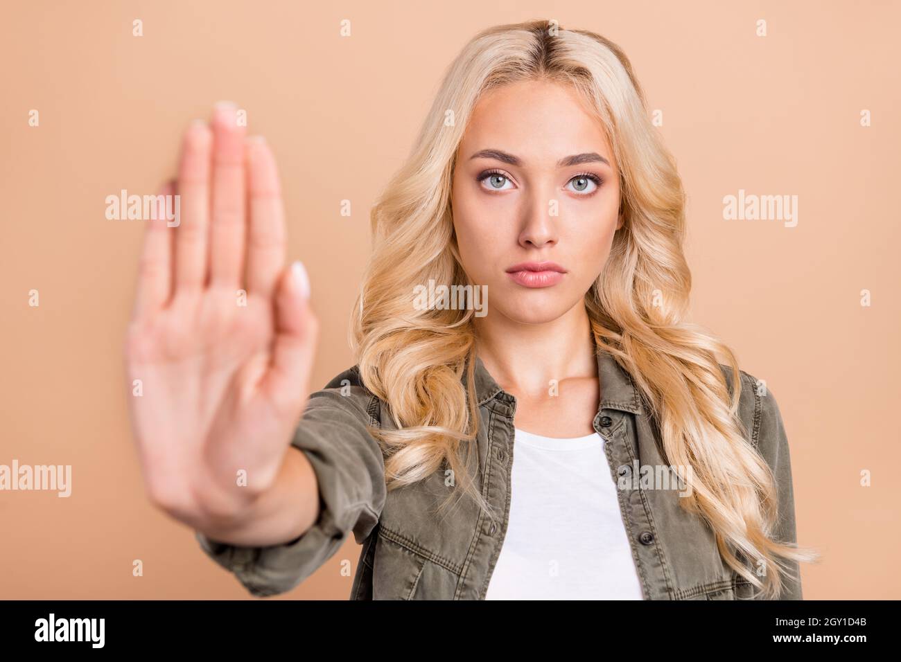 Photo portrait woman serious showing stop sign prohibition isolated ...