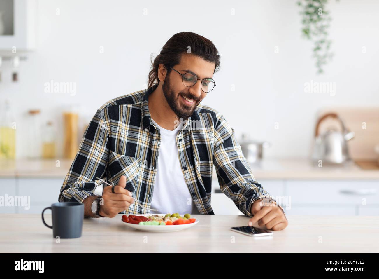 Indian man eating breakfast hi-res stock photography and images - Alamy
