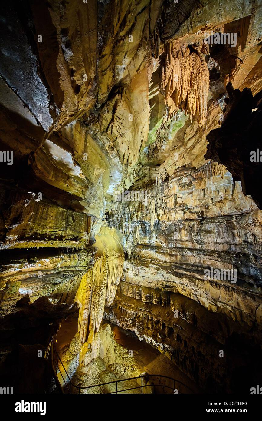 Vertical of underground cave with large formations of stalagmites and ...