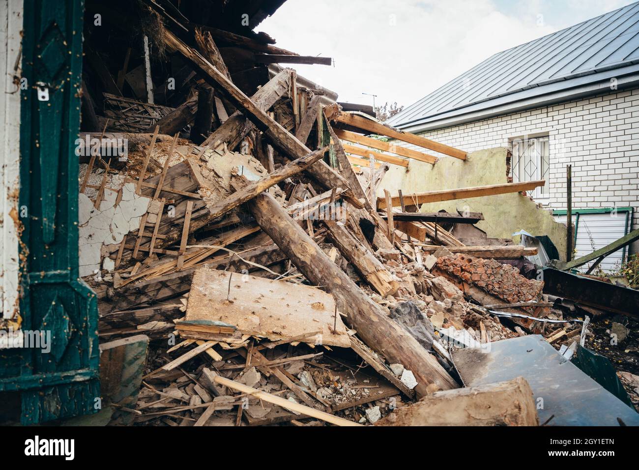 Old wooden and stone ruined building close up. Dismantling of house or ...