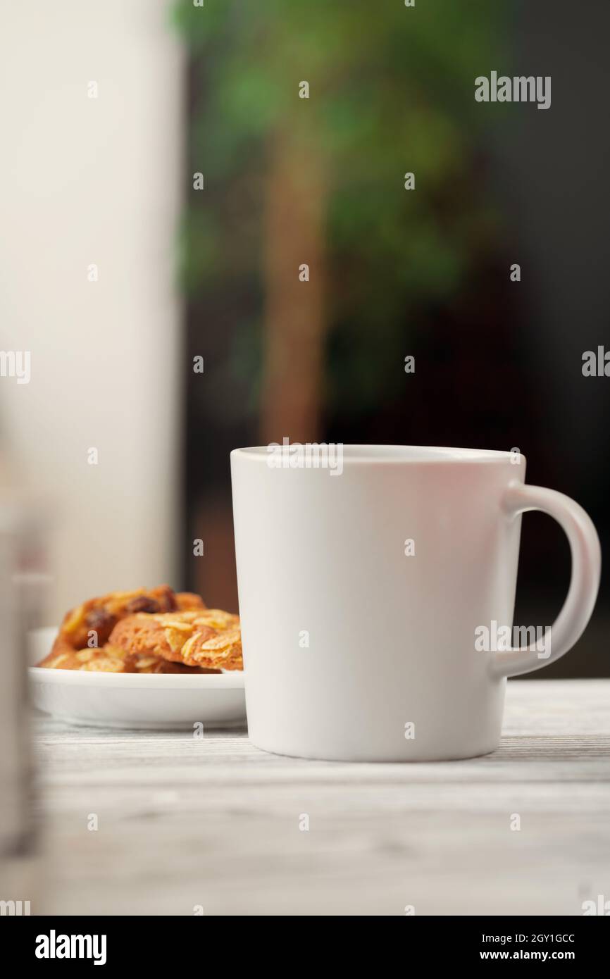 White porcelain cup on kitchen counter close up Stock Photo - Alamy