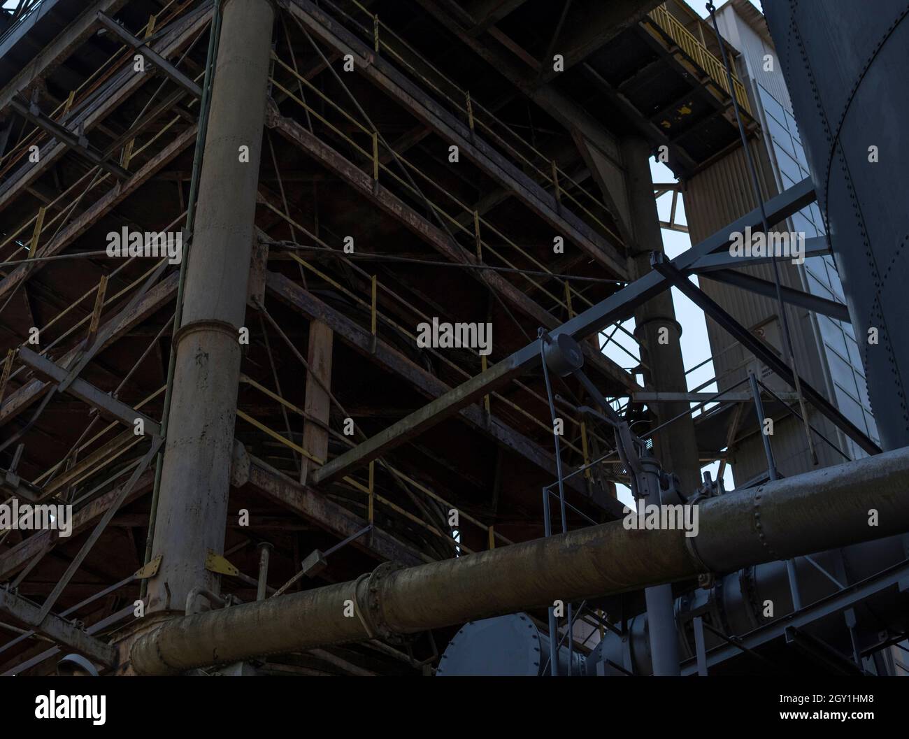 Metal construction which is a part of steel mill industry building ...