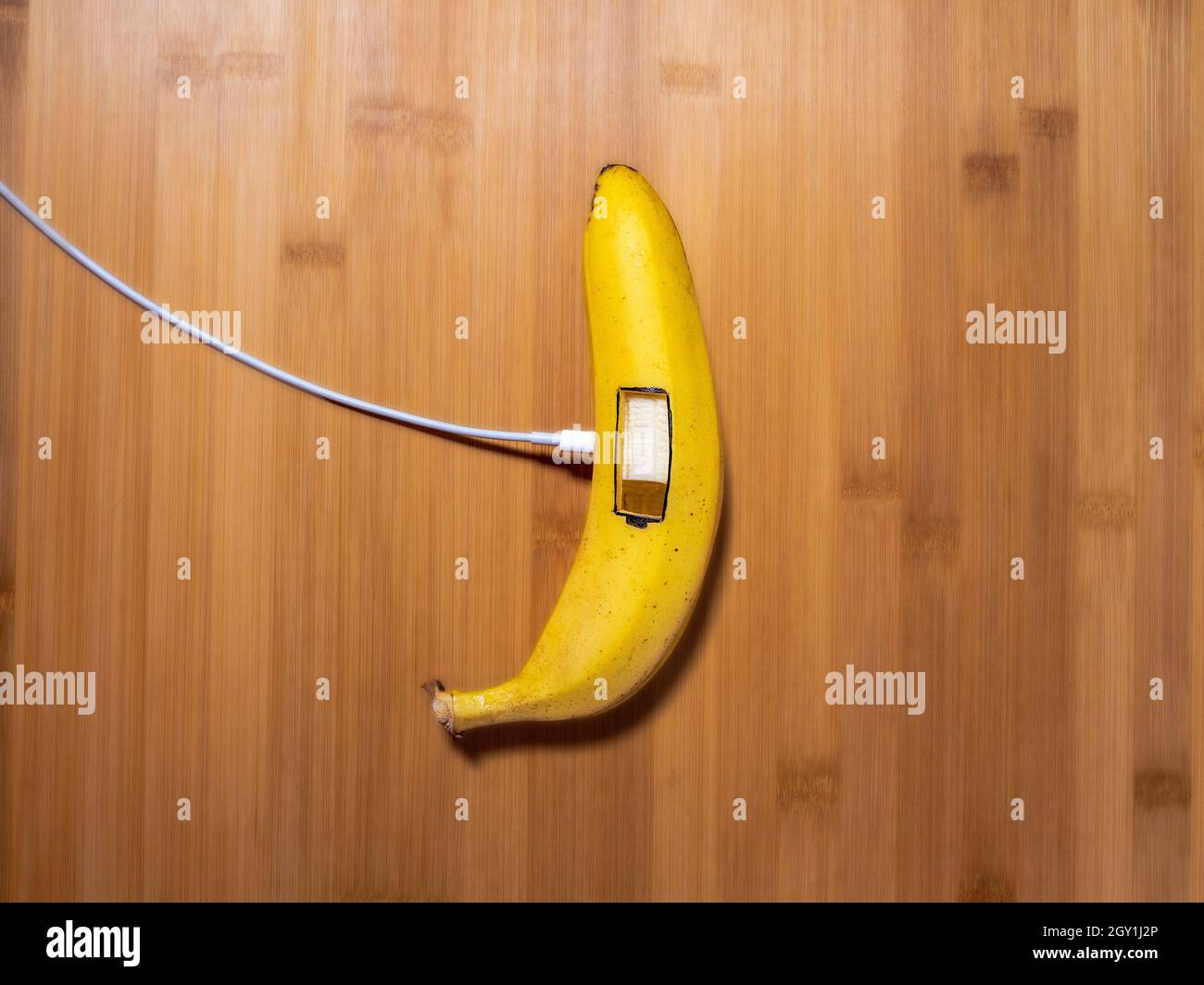 Banana battery - wood as a background, free energy, the concept of ...