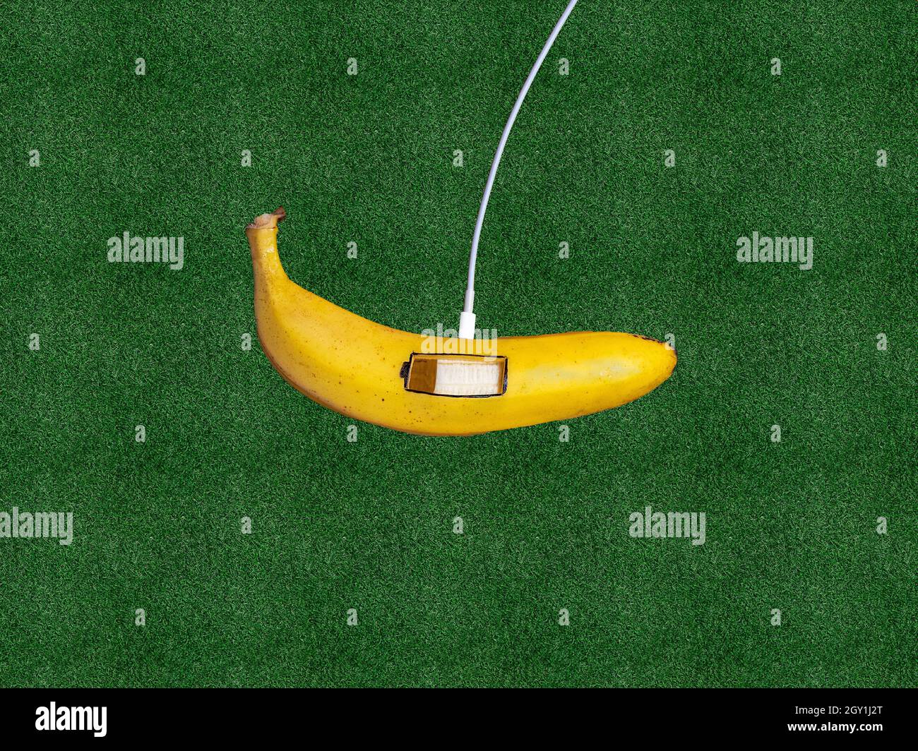 Banana battery - green grass as background, free energy, ecology ...