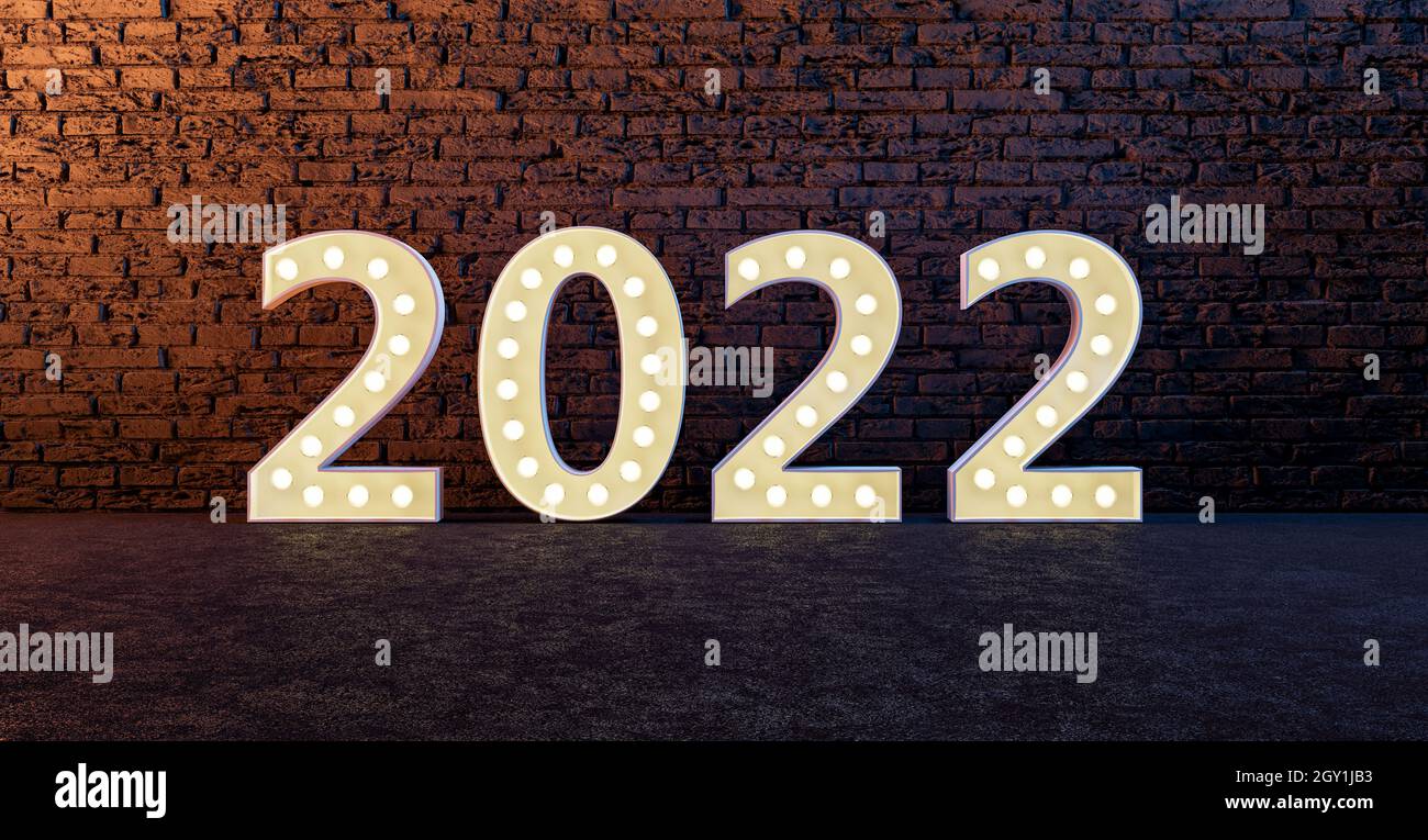 New year 2022 sign with lights bulbs on brick wall with warm lighting ...