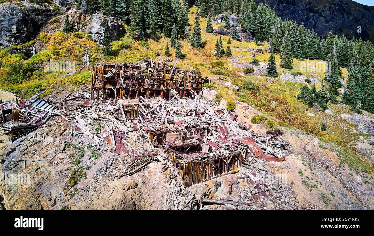Close aerial view of old mining mill structure abandoned and falling ...
