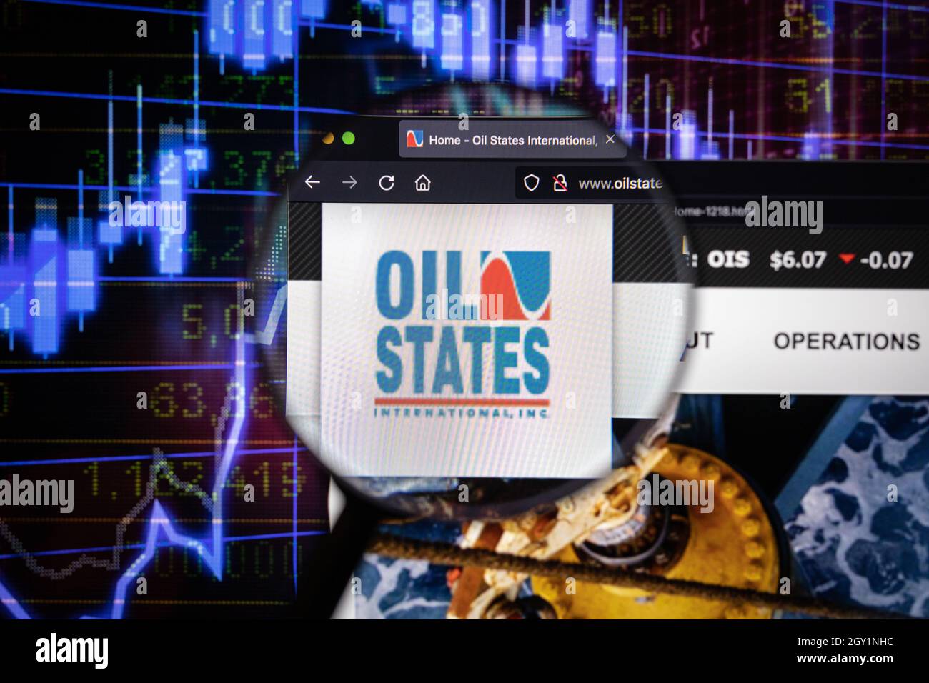 Oil States company logo on a website with blurry stock market ...